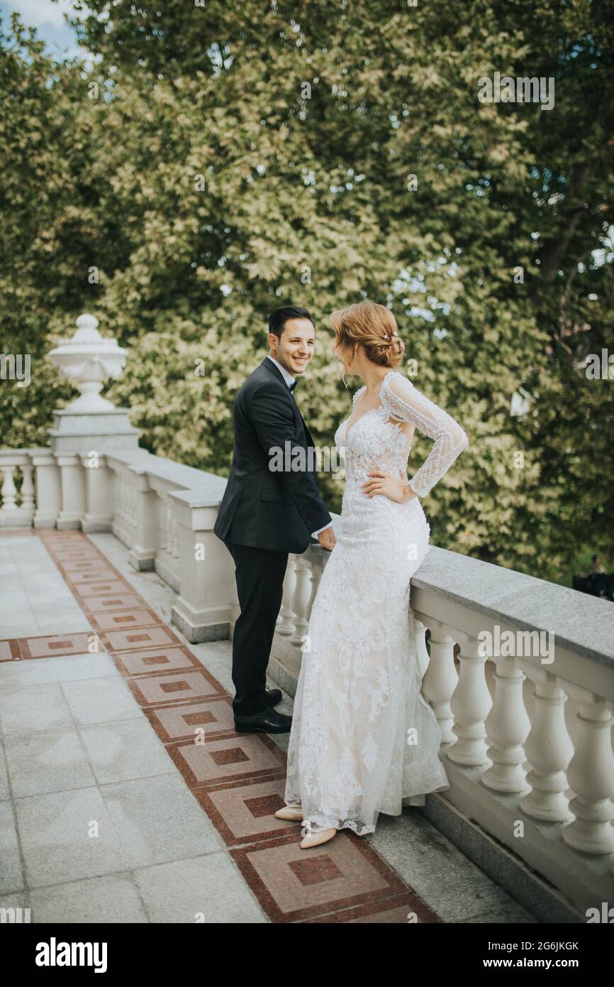 Bride And Groom Poses Outside A Rainy, Yet Beautiful, Outdoor Wedding