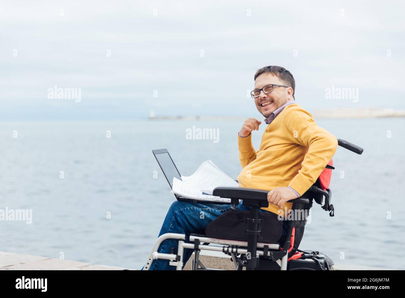 man with disabilities in wheelchair job business Stock Photo - Alamy