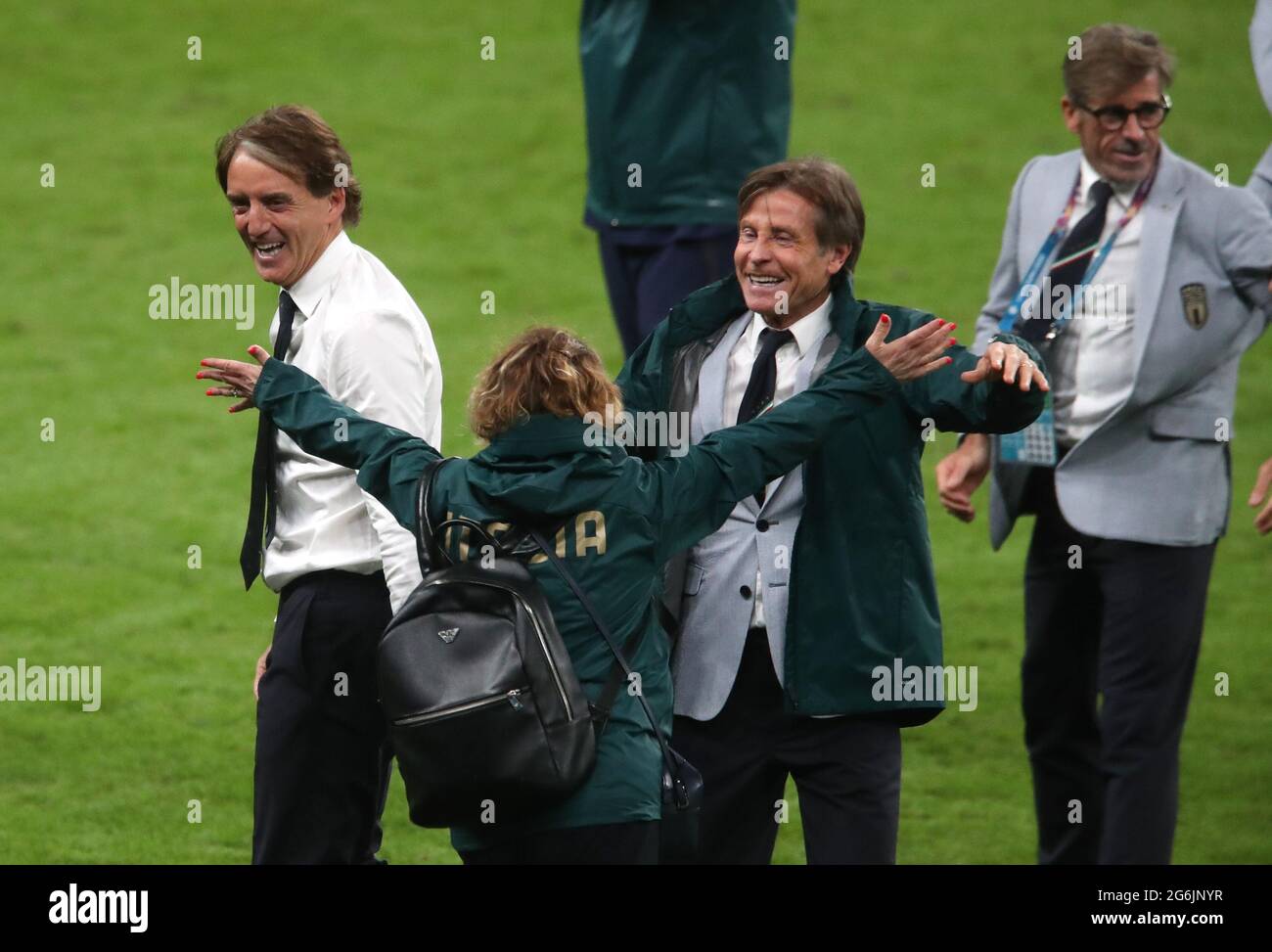 Italy manager Roberto Mancini (left) reacts on his side's victory ...