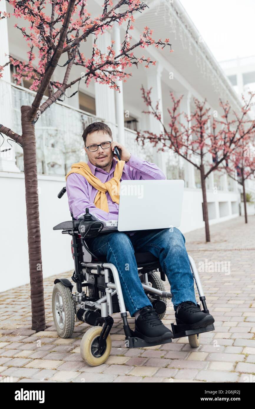man disabled with wheelchair work business online Stock Photo - Alamy