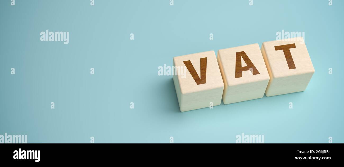 Wooden toy blocks forming the word "vat" - value added tax concept ...