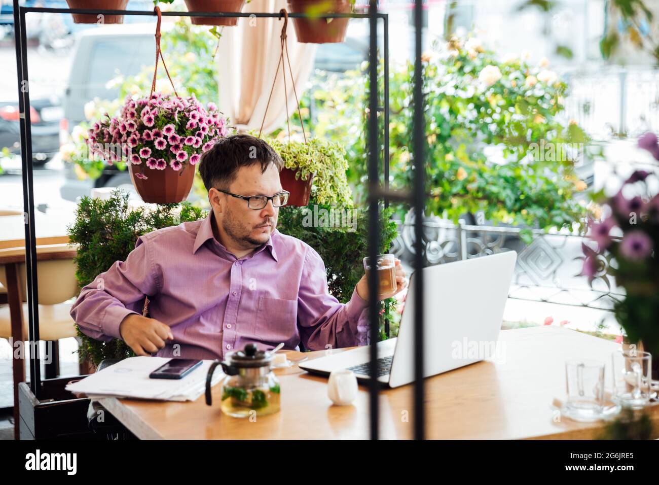 disabled man with wheelchair in restaurant eating Stock Photo - Alamy