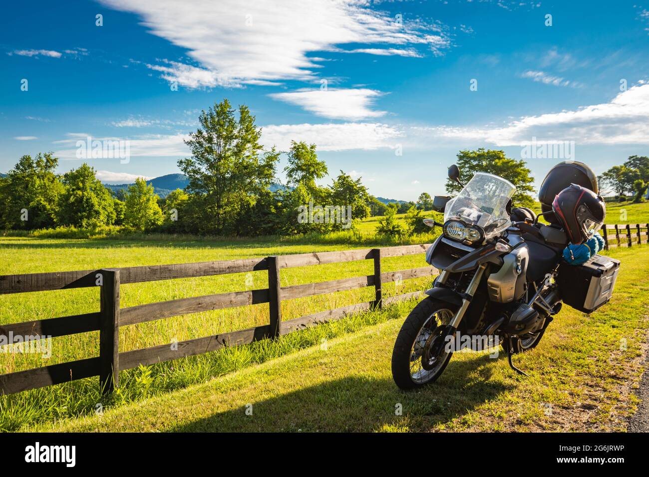 Adventure motorcycle riding country roads in the morning backpack ...