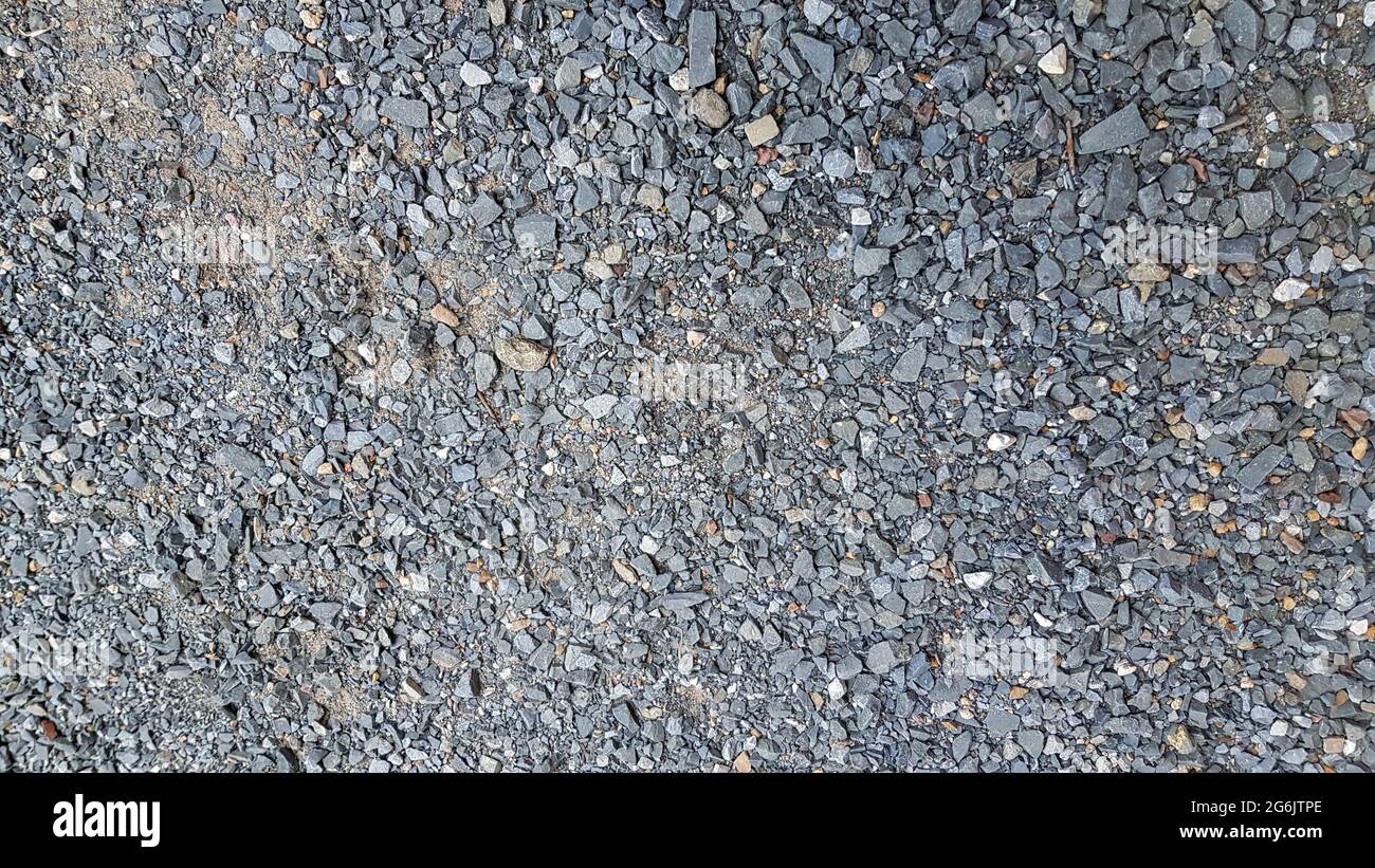 Granite gravel, stones, crushed stone close-up. Rough seamless texture ...