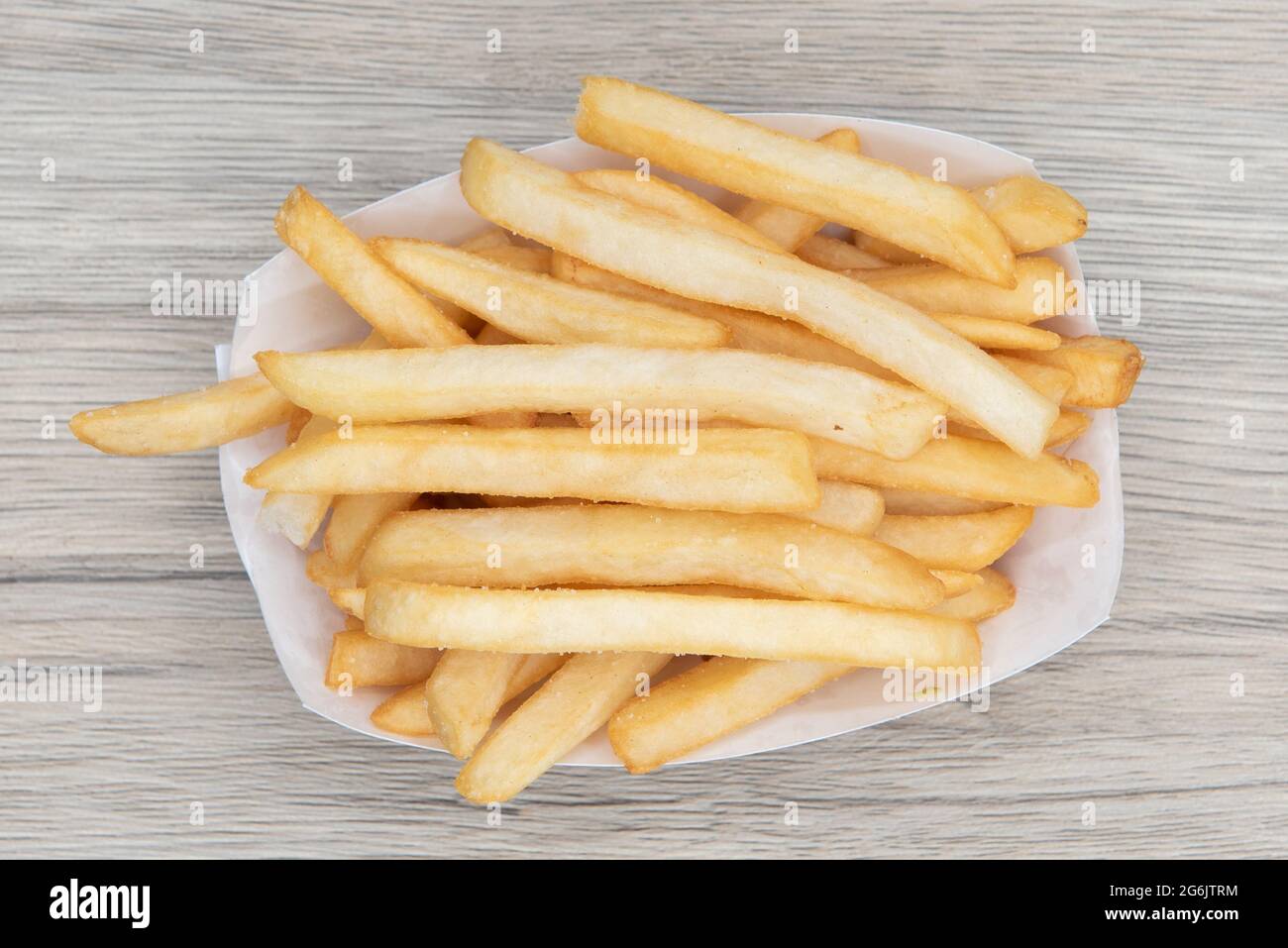 Overhead view of side order of french fries are delicious to eat all by ...