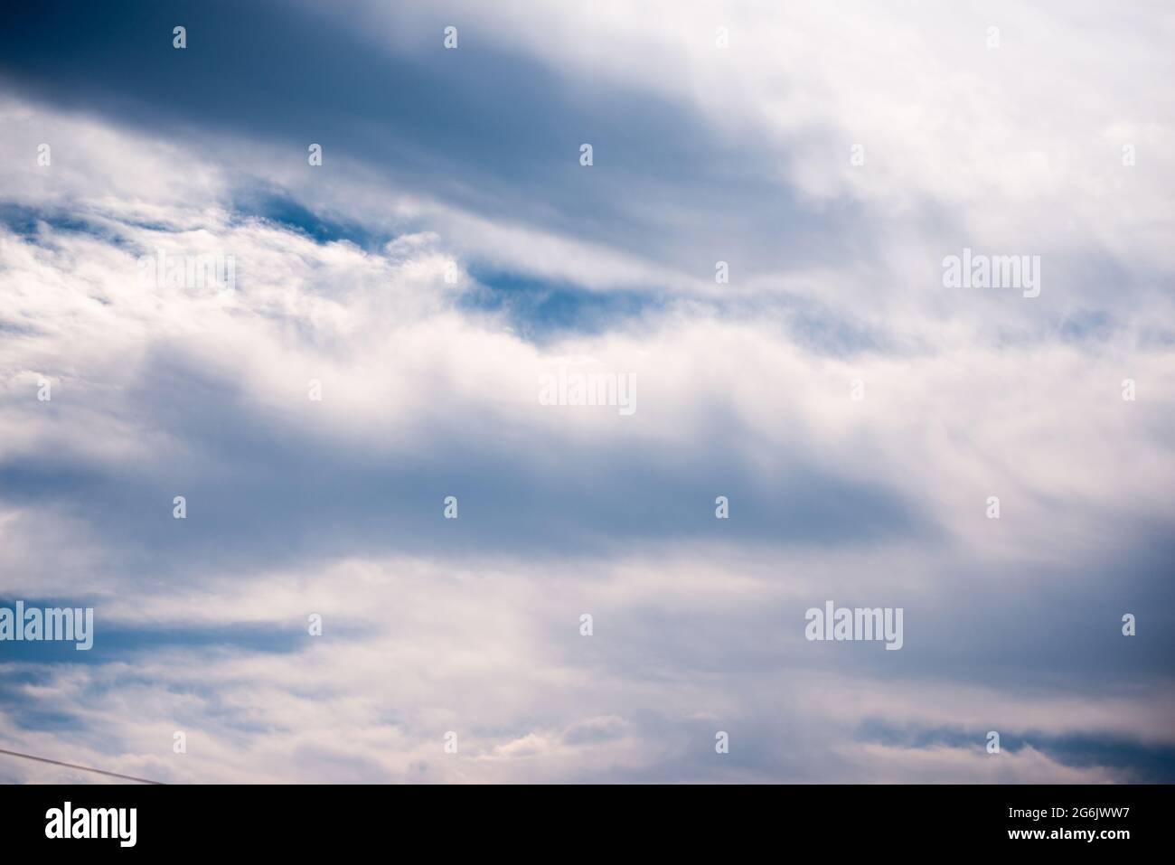 Scattered cloud clusters in a blue sky, blue sky background with white ...