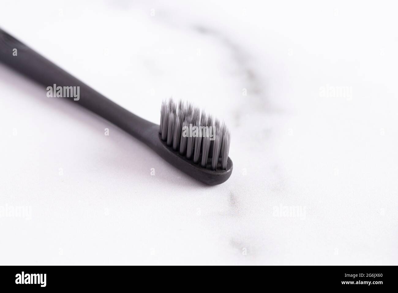 A Black Toothbrush without Toothpaste on a Marble Counter Stock Photo ...