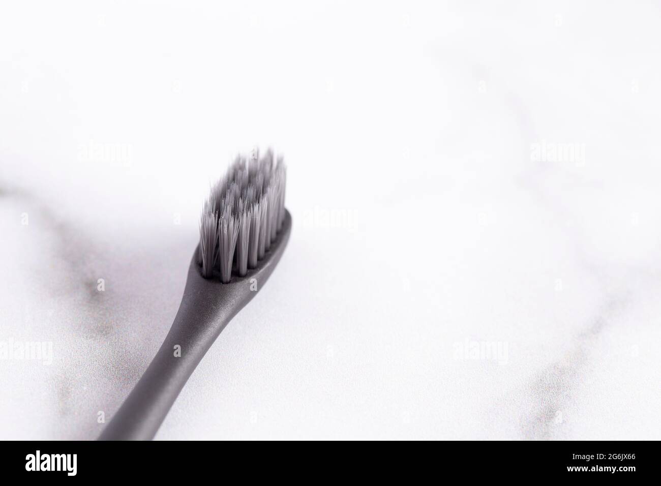 A Black Toothbrush without Toothpaste on a Marble Counter Stock Photo ...
