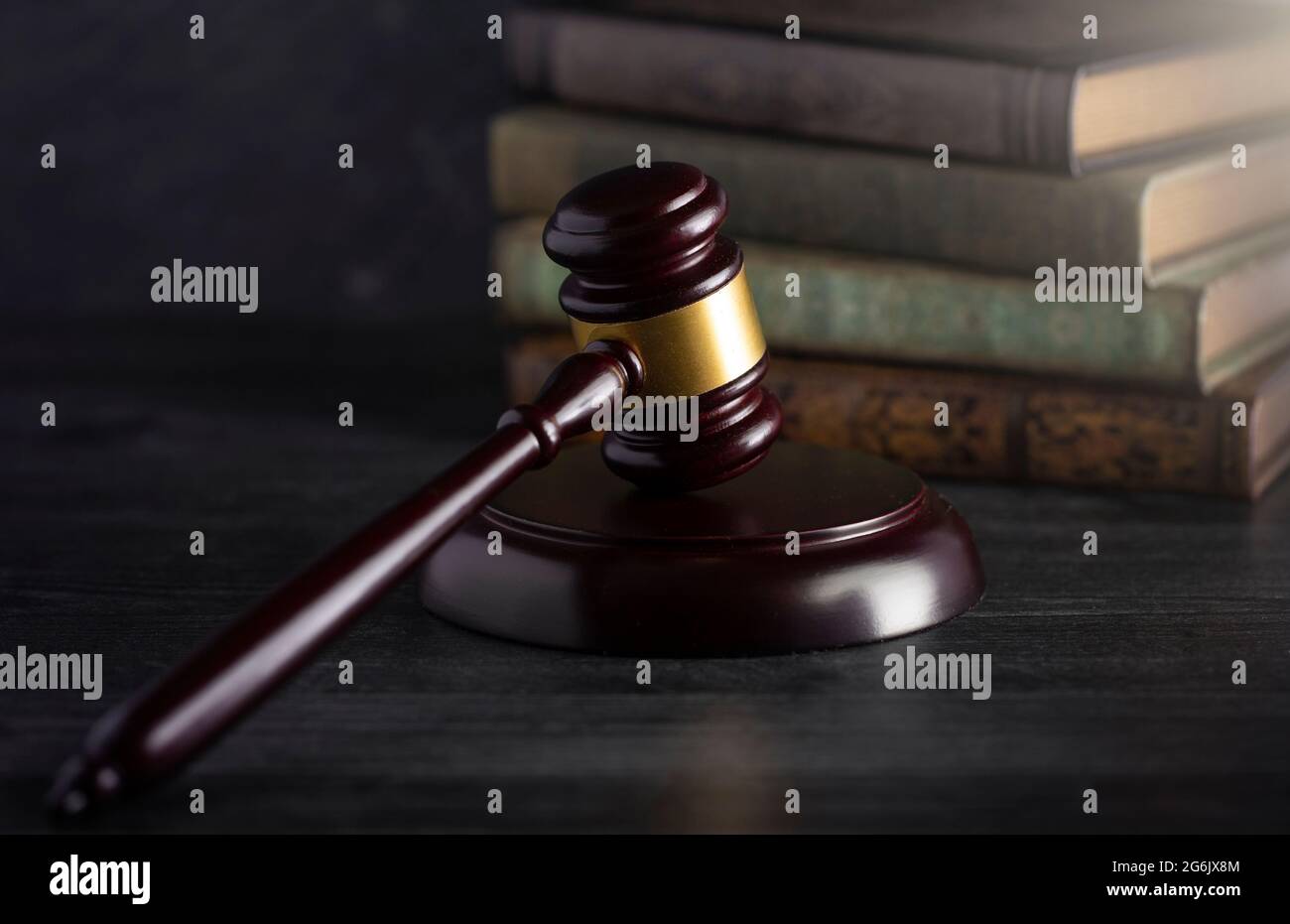 Wooden Judges Gavel on a Desk with Books in the Background Stock Photo ...