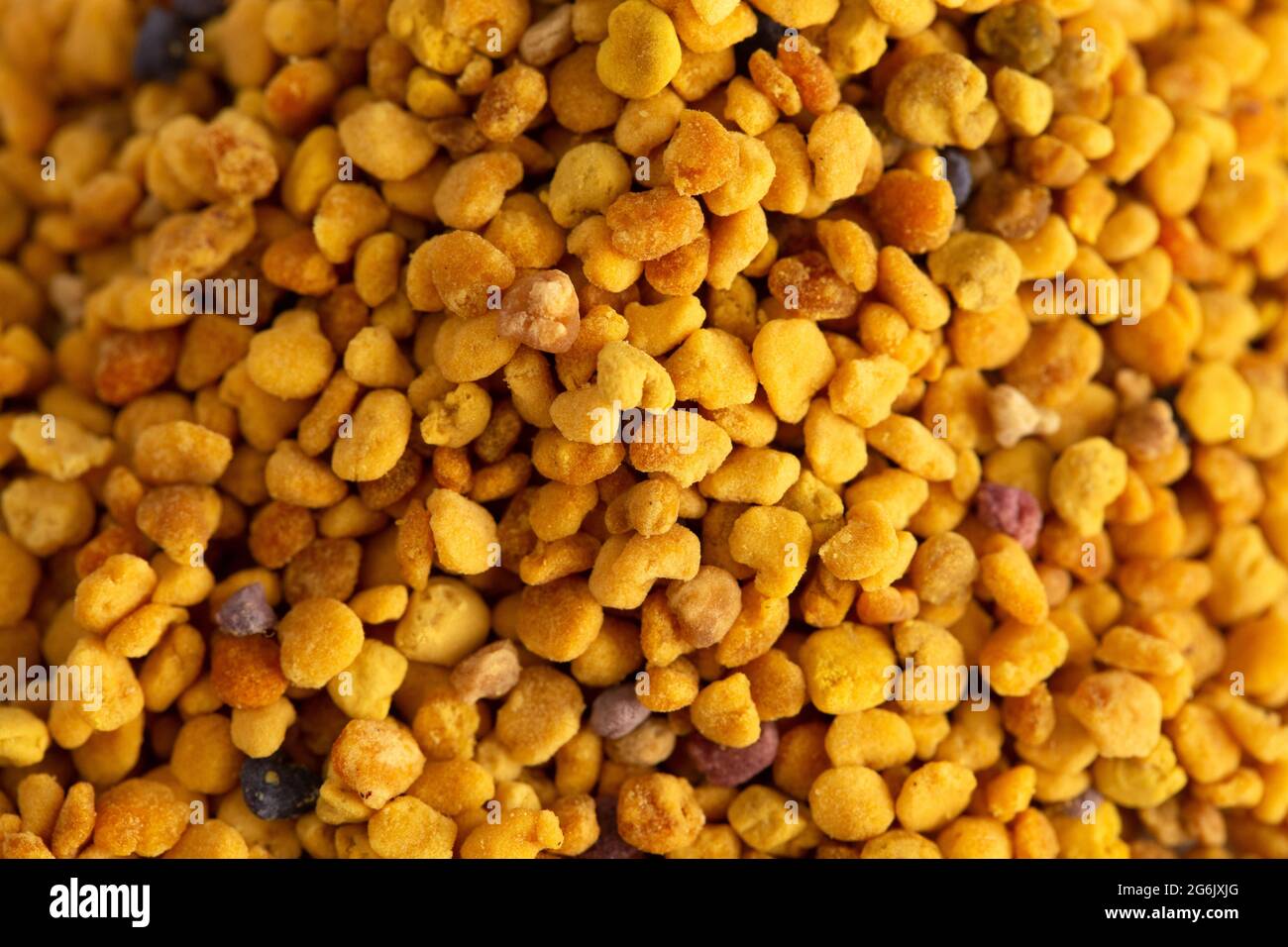 A Background of Yellow Bee Pollen Pellets Stock Photo - Alamy