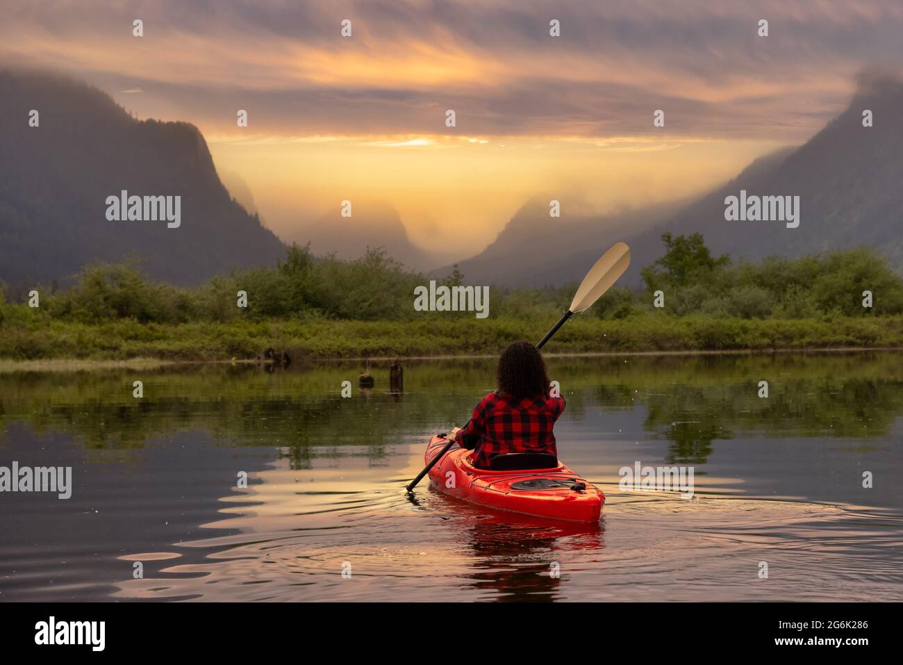 Adventure Caucasian Adult Woman Kayaking in Red Kayak Stock Photo - Alamy