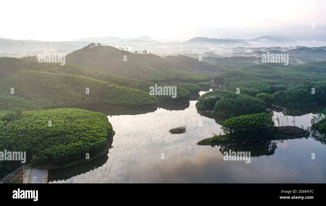 Nice lake with mountain view in central Vietnam Stock Photo - Alamy
