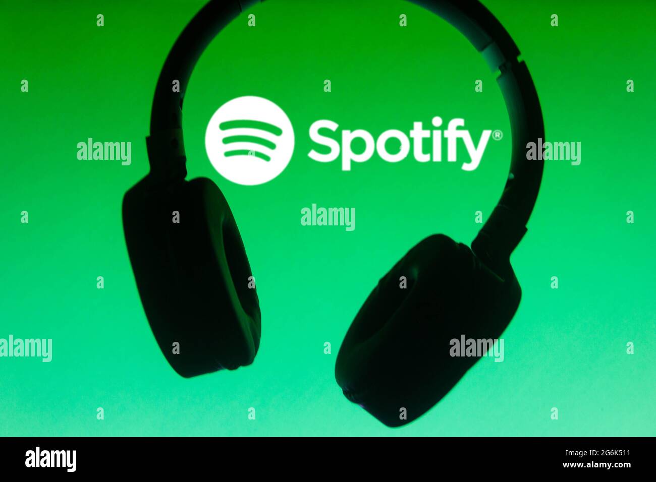In this photo illustration the Spotify logo is displayed along with the ...