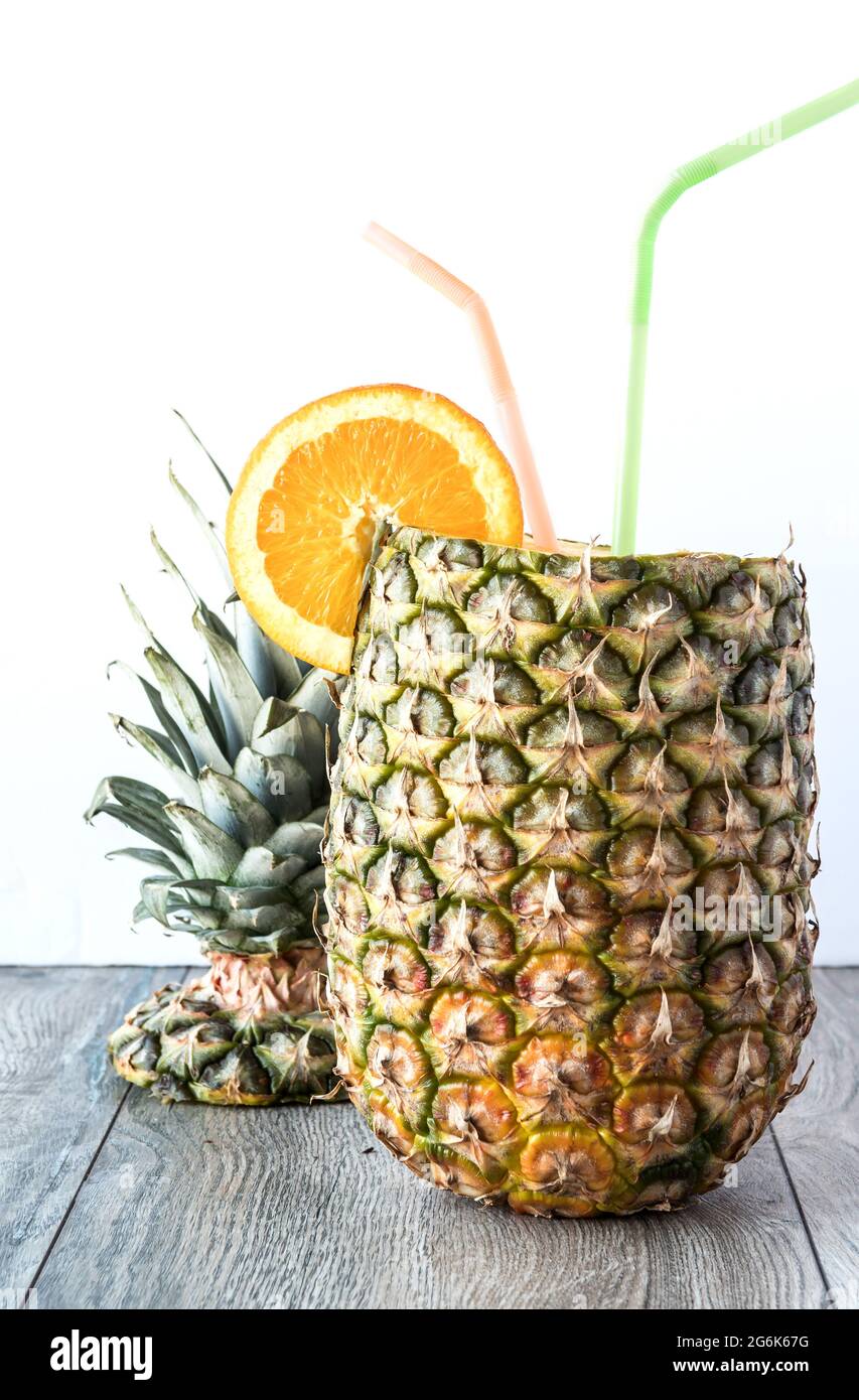 pineapple and oranges close-up on wood with white background Stock ...