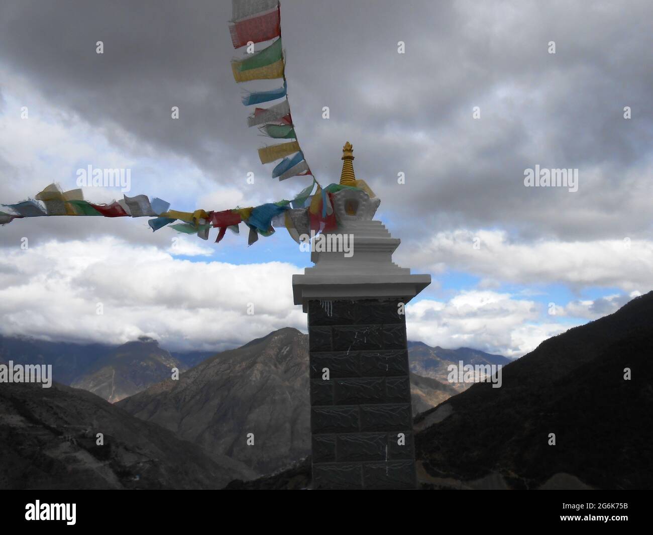 Tibetan Buddhist Shrine with Mountain View Stock Photo - Alamy