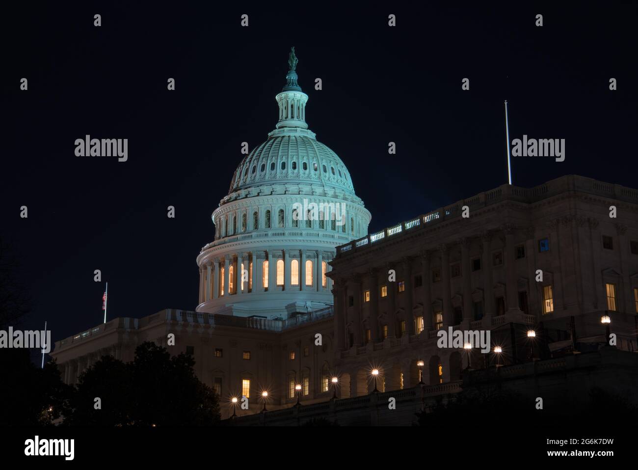 Washington DC Capitol at night with a side view Stock Photo - Alamy
