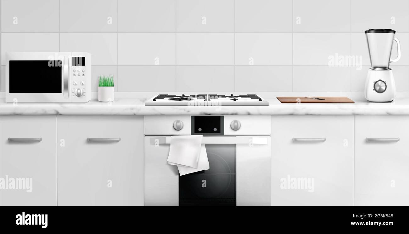 Kitchen counter top with microwave oven, gas stove, electric blender ...