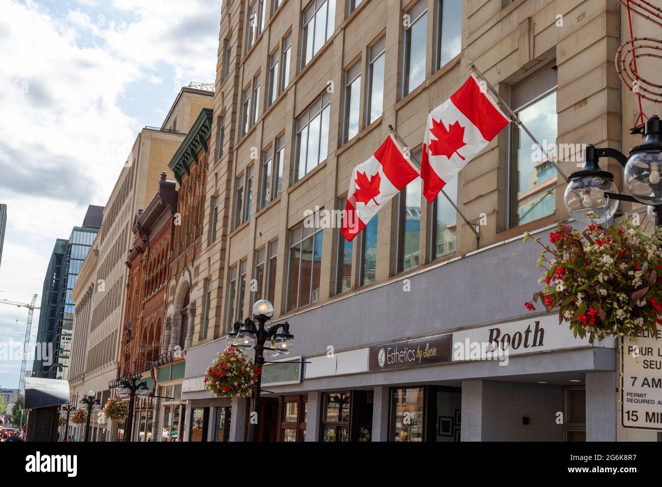 Ottawa, Canada - July 1, 2021: Cityscape street view with canadian flags on buildings in ...