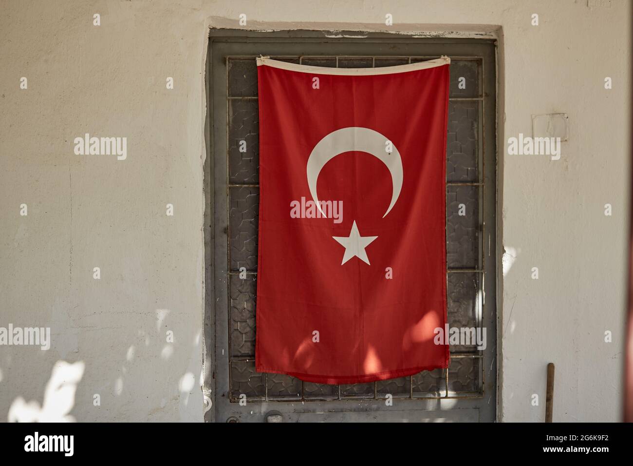 Old turkish province with old house and big turkish flag in bright ...
