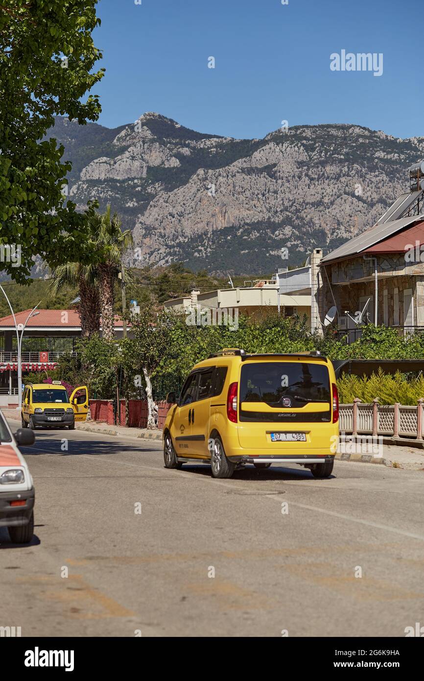 Alanya, Turkey - May 24, 2021: Yellow taxi on the road on bright sunny ...