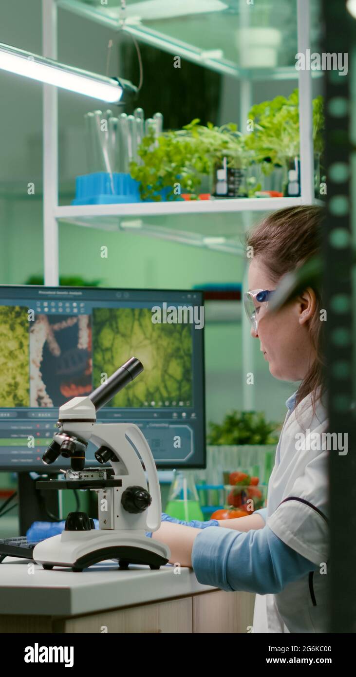 Biochemistry doctor examining chemical test using microscope for ...