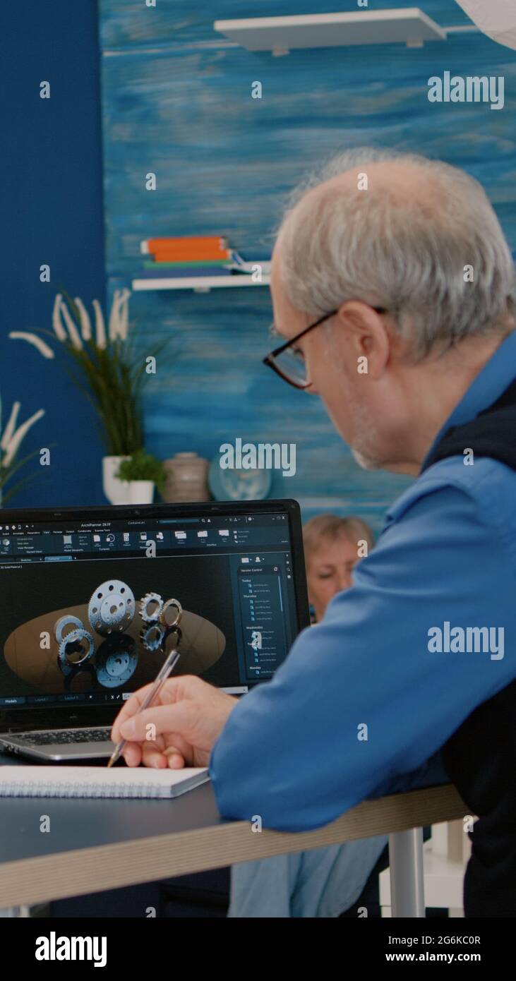 Senior remote man architect working on modern cad program analysing ...