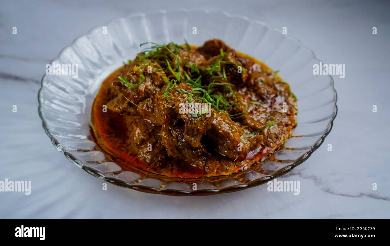 Beef Rendang spicy delicious meat dish cooked with herbs, spices and ...