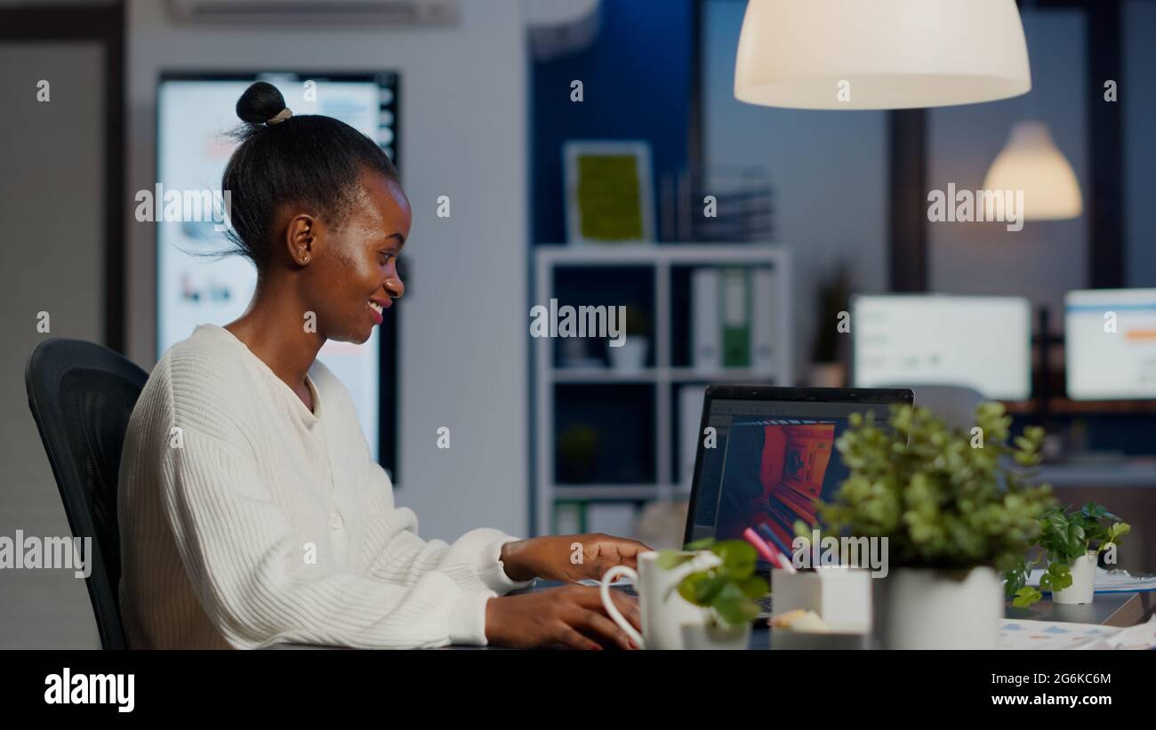 Black freelancer game developer typing on keyboard developing new level ...