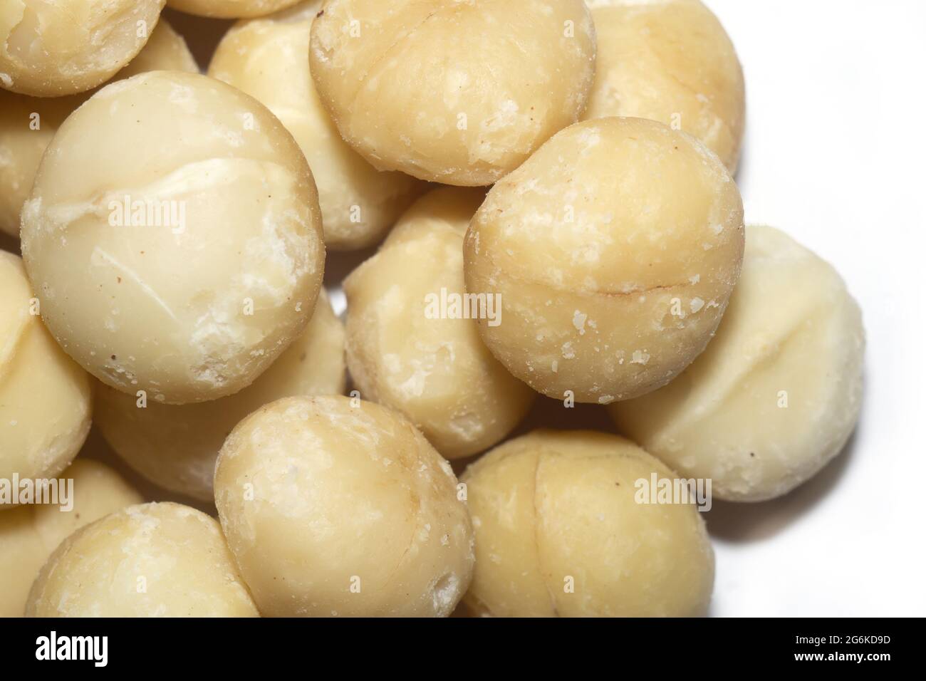 Peeled fresh macadamia nuts close up background Stock Photo - Alamy