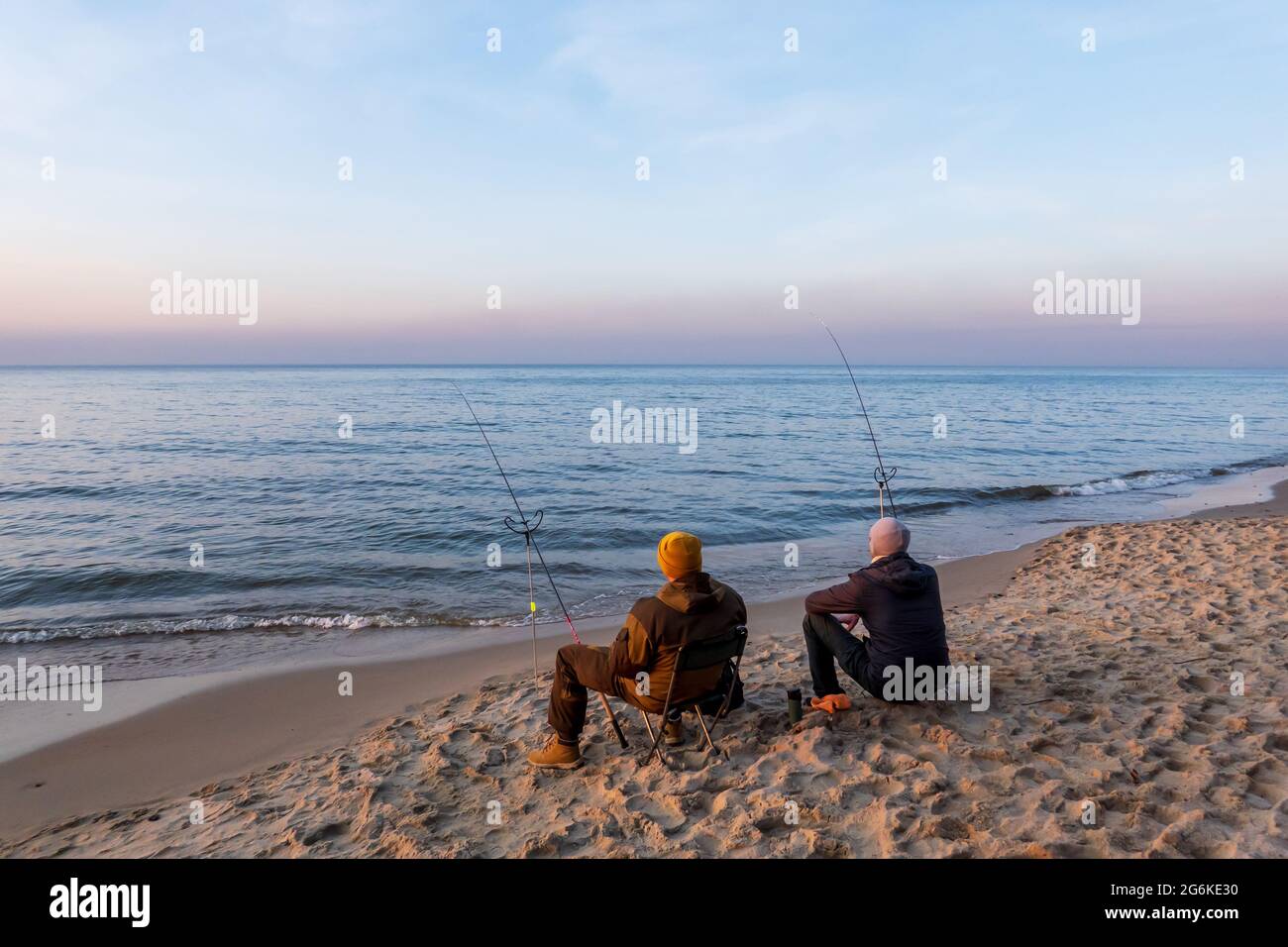 Unrecognizable fishermen catching fish in sea Stock Photo - Alamy