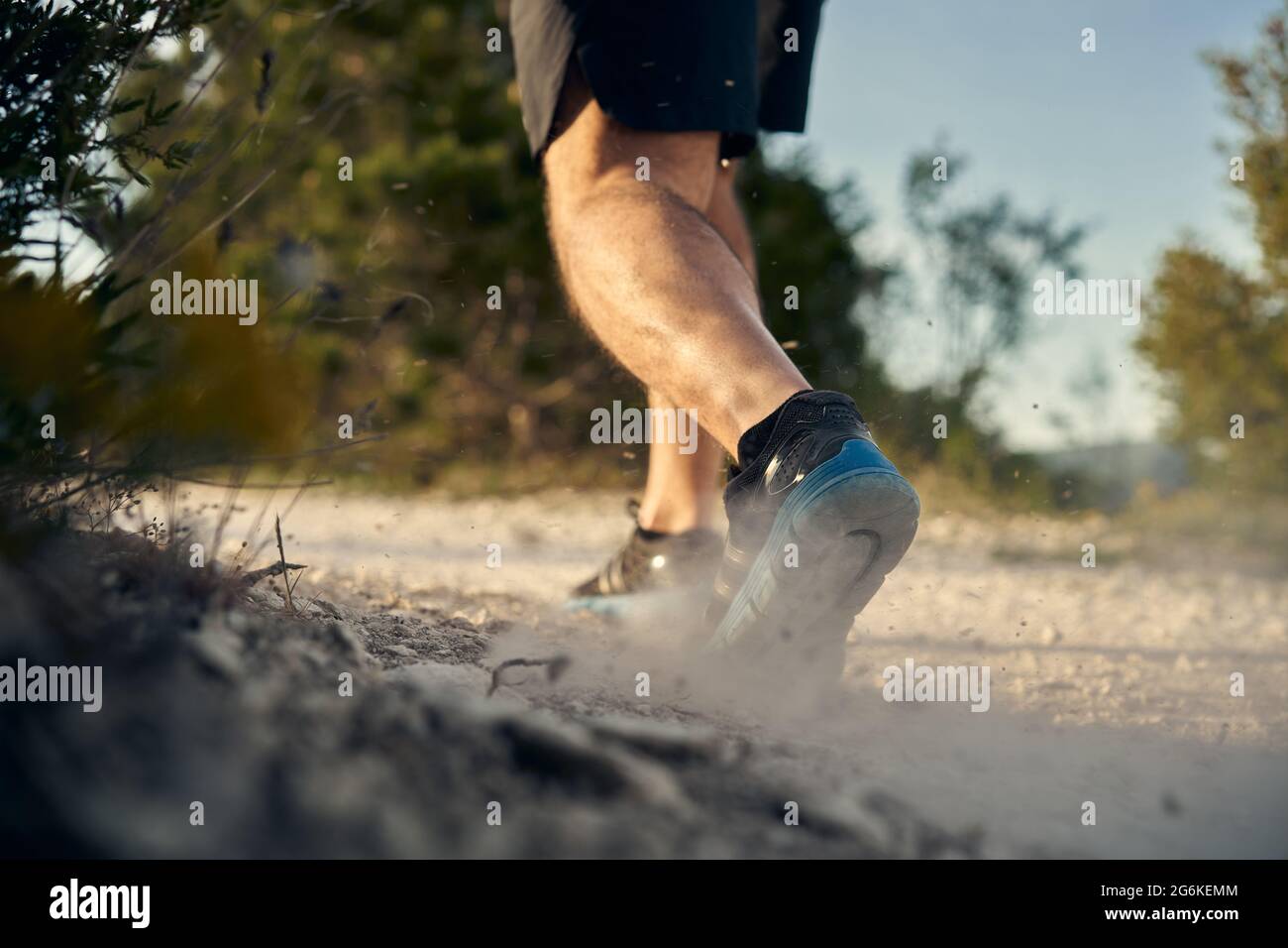 Close up of male muscular legs running up the hill Stock Photo - Alamy