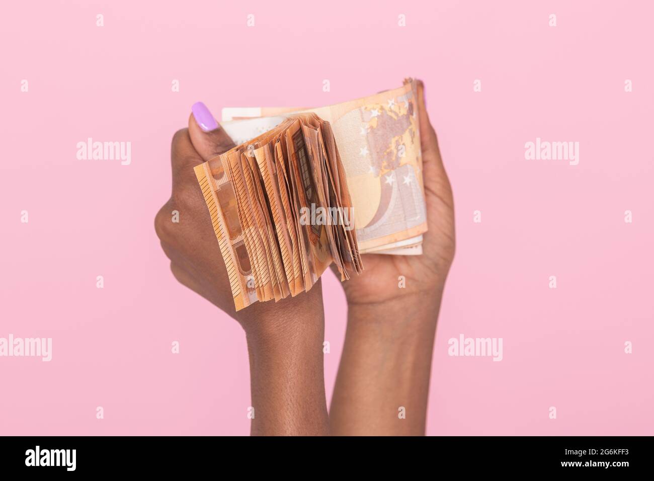 Close up of a bunch of money bills being held by female hands ...