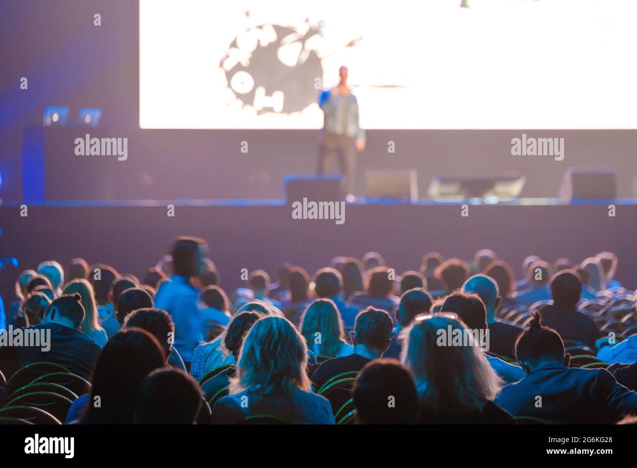 Audience sitting near illuminated stage Stock Photo - Alamy