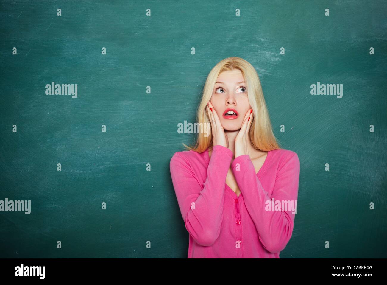 Modern attractive teacher. Portrait of smart young teacher with ... Modern attractive teacher. Portrait of smart young teacher with ...
