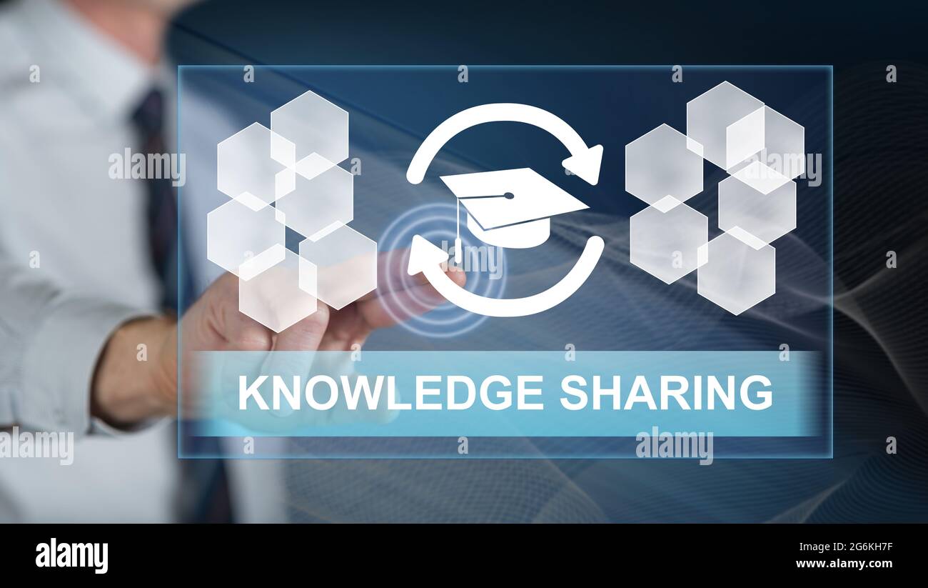 Man touching a knowledge sharing concept on a touch screen with his ...