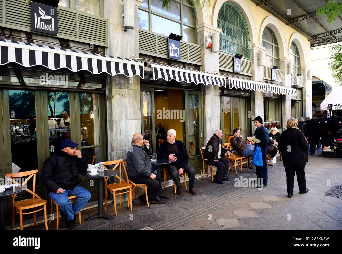 Greeks enjoying local Greek coffee in a popular cafe near the Athens ...