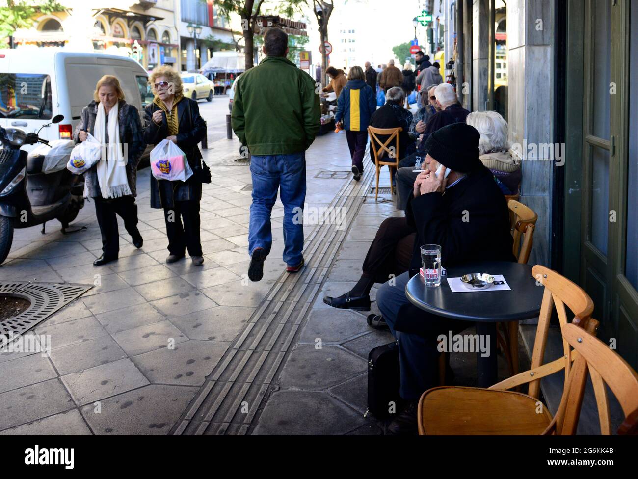 Greeks enjoying local Greek coffee in a popular cafe near the Athens ...