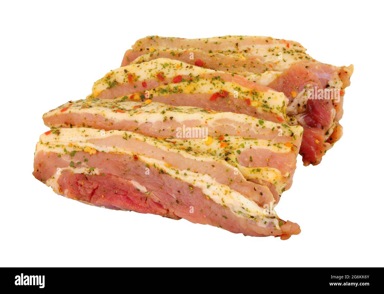 Raw chilli marinated pork belly slices isolated on a white background ...