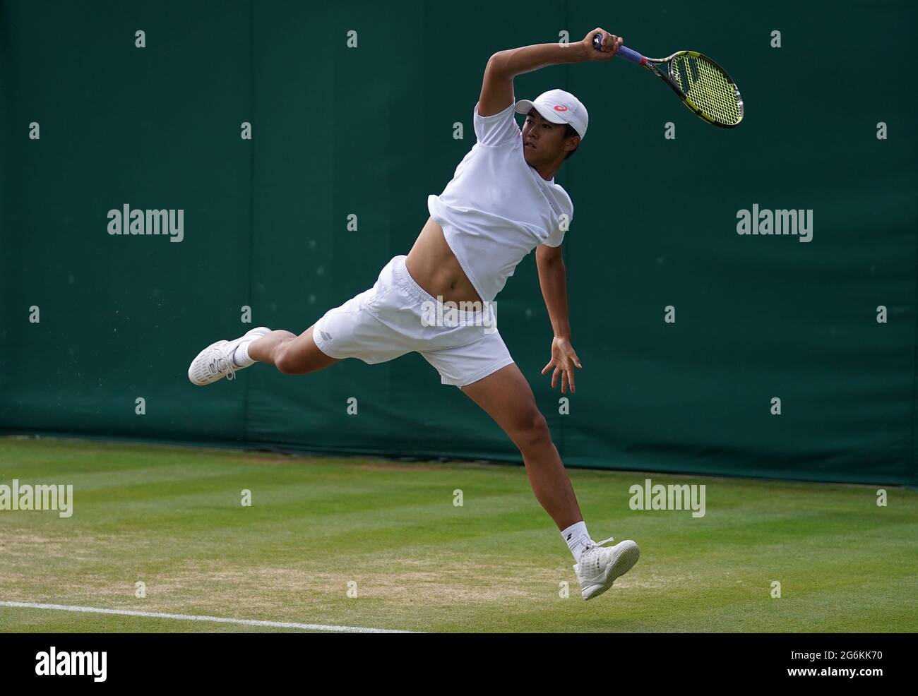 Derrick Chen in action on day eight of Wimbledon at The All England Lawn Tennis and Croquet Club ...