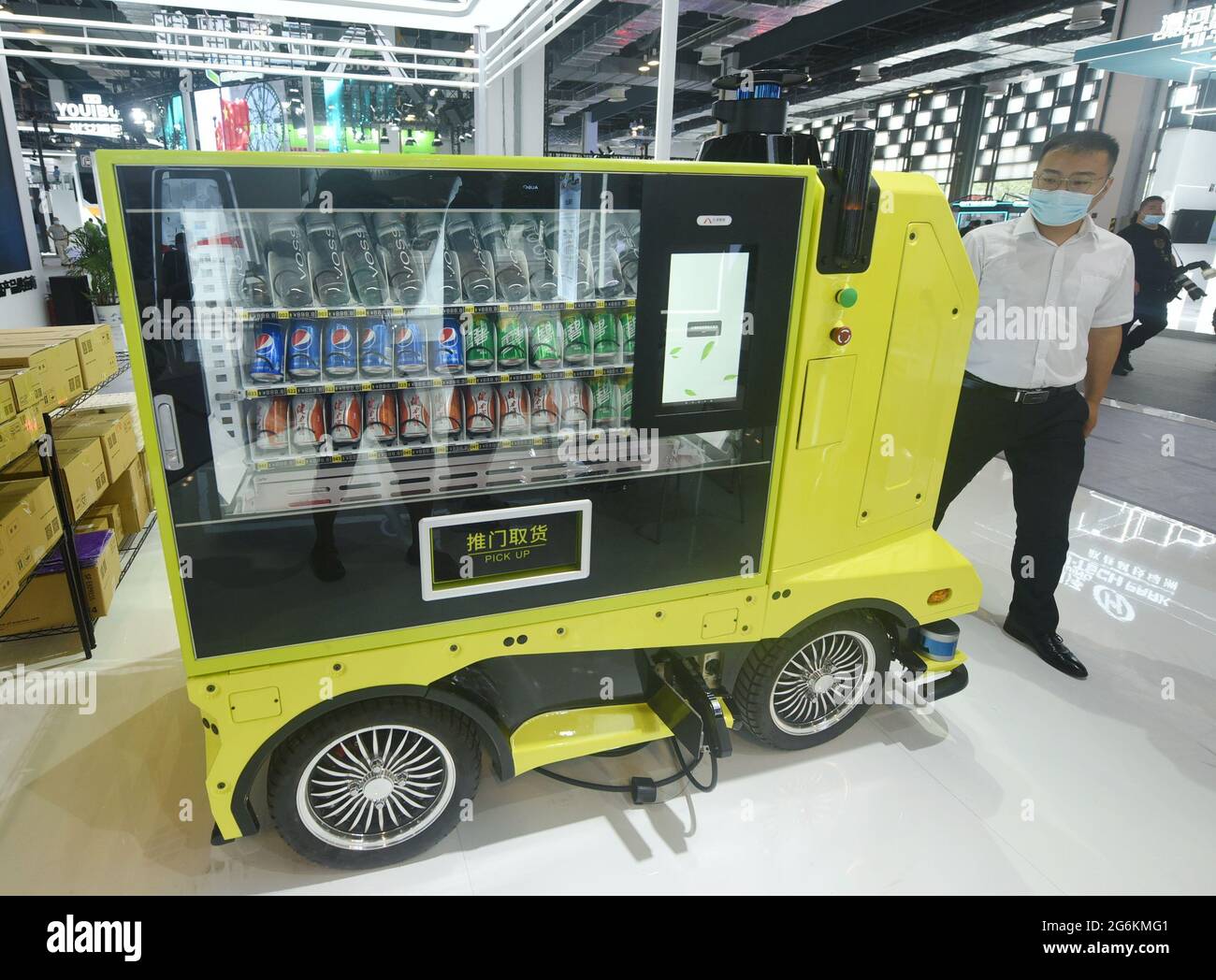 SHANGHAI, CHINA - JULY 7, 2021 - Visitors look at a retail unmanned ...