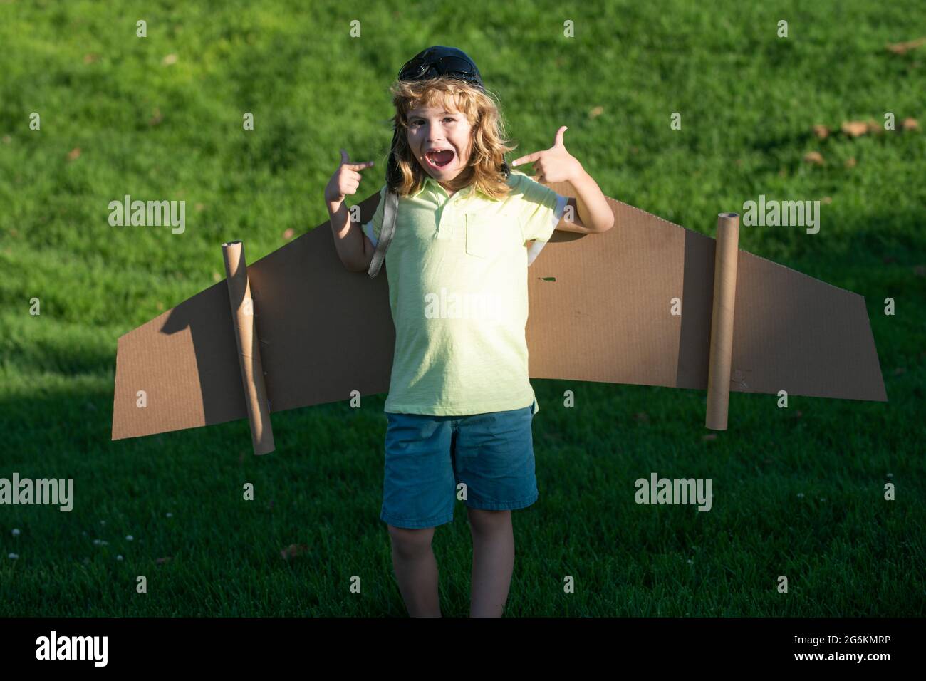 Child boy playing pilot on the sky blue background. Kid dreaming. Child ...