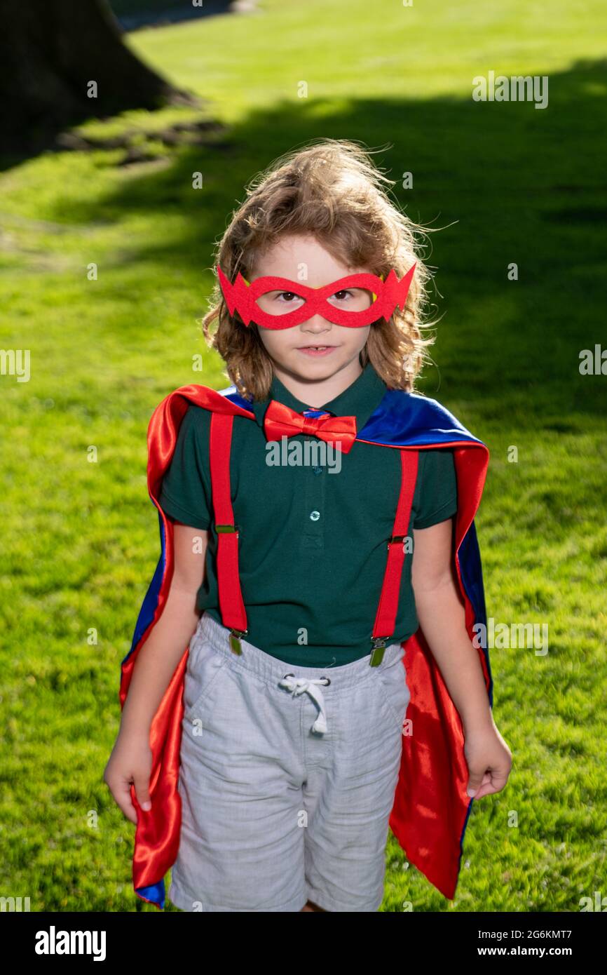 Superhero kid outdoor in park. Child power concept Stock Photo - Alamy