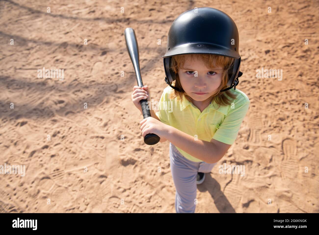 Kid holding a baseball bat. Pitcher child about to throw in youth ...