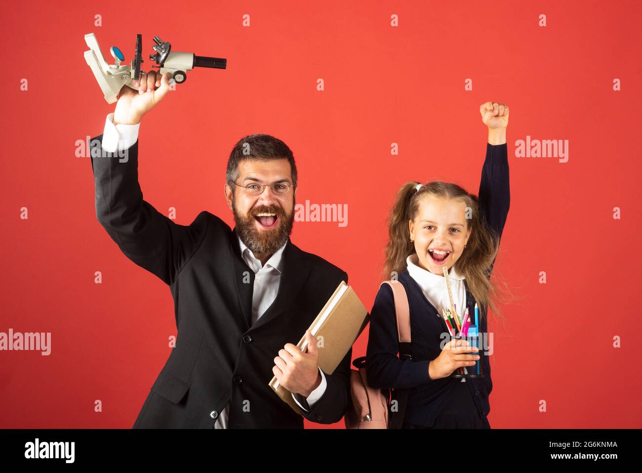 Tutor with school girl with successful exercise finish Stock Photo - Alamy