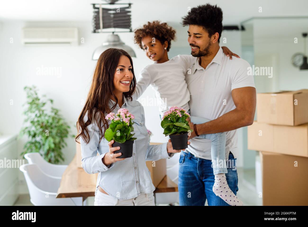 Parent child relocation love fun concept. Happy multiethnic family ...