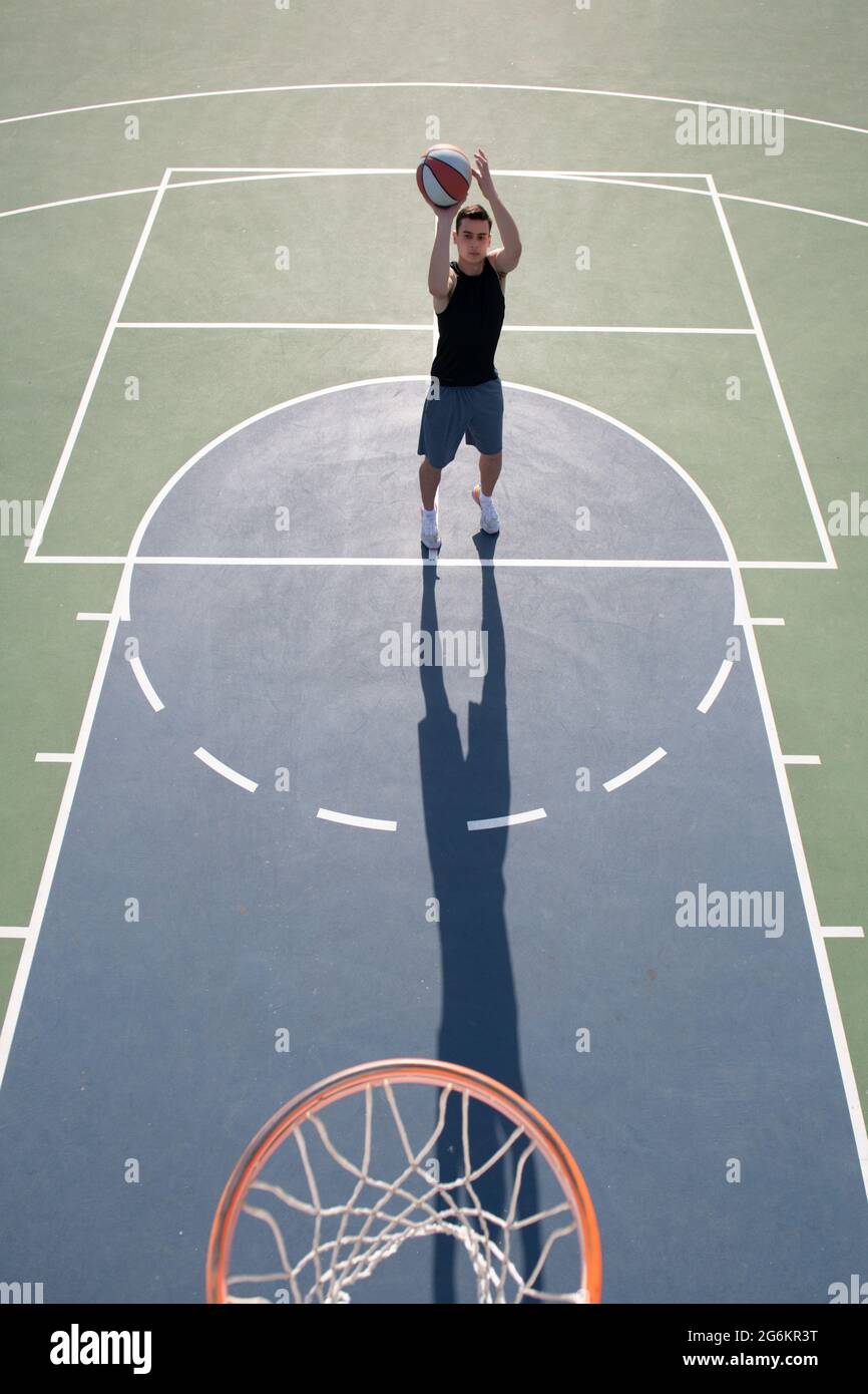Basketball player, top view. Man playing basketball, above hoop of man ...
