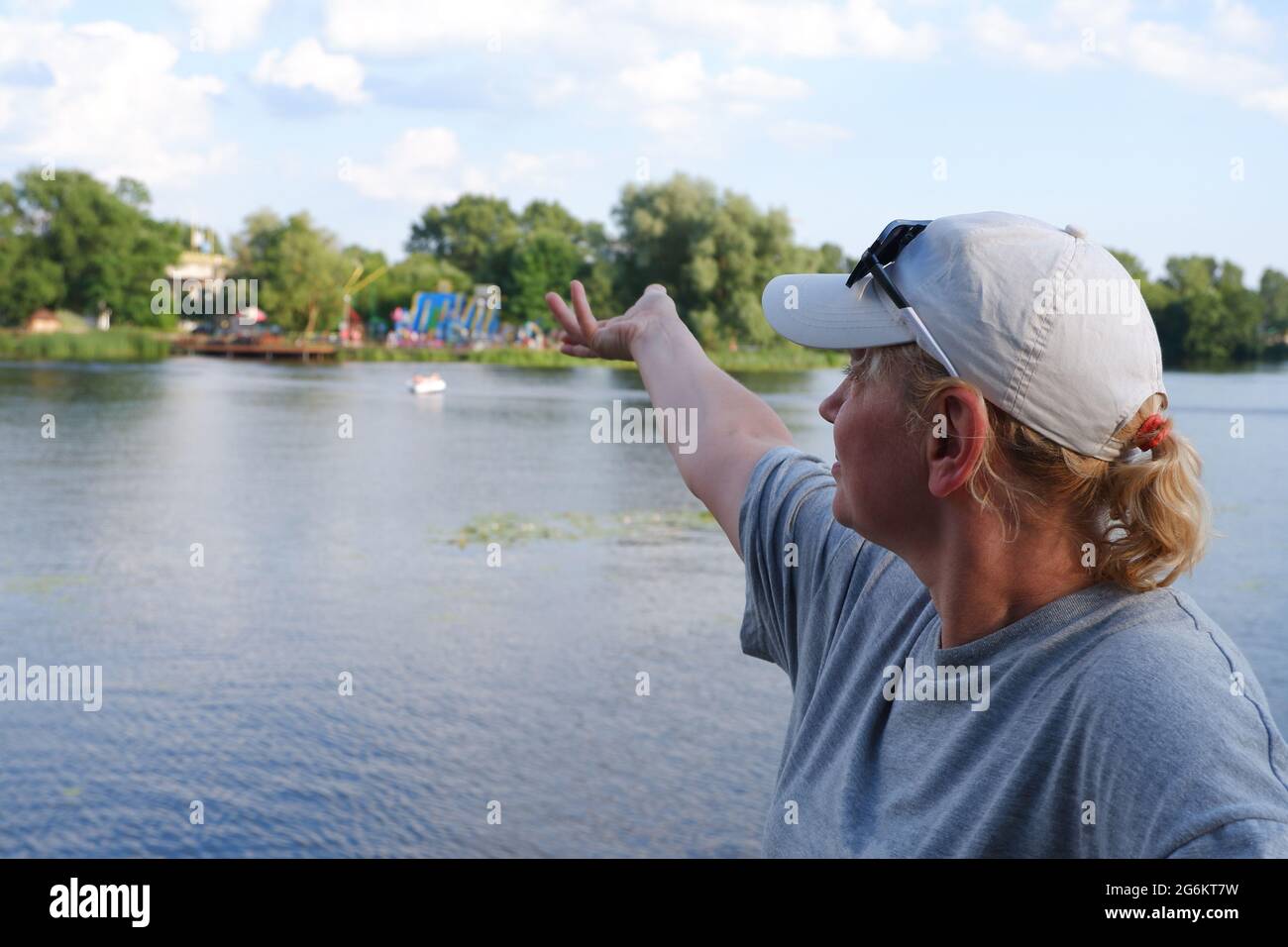A tourist girl in a white cap inspects an unfamiliar area Stock Photo ...