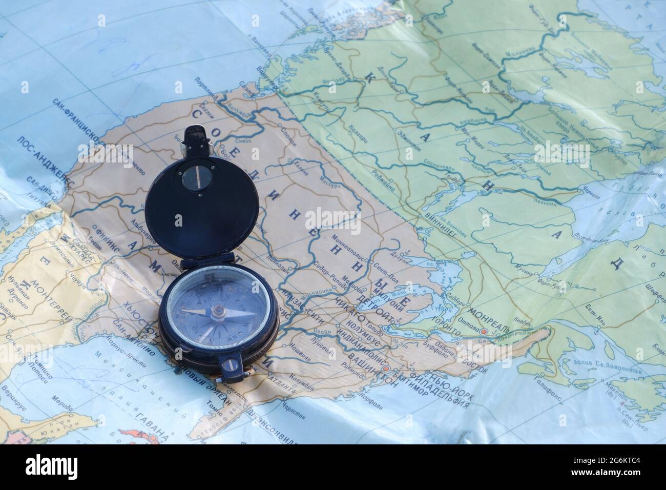Old compass on the Russian-language map of the world. Concept Stock ...
