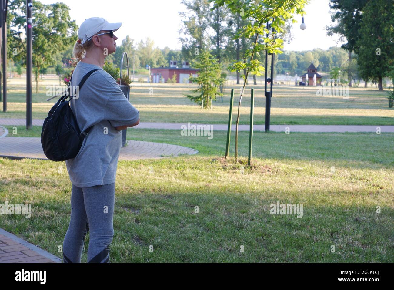 A tourist girl in a white cap inspects an unfamiliar area Stock Photo ...