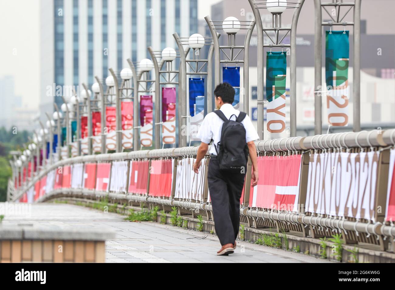 Tokyo, Japan. JULY 6, 2021 : A man walks on the Yume-no-ohashi bridge ...